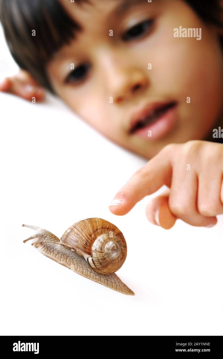 Snail and kid Stock Photo - Alamy