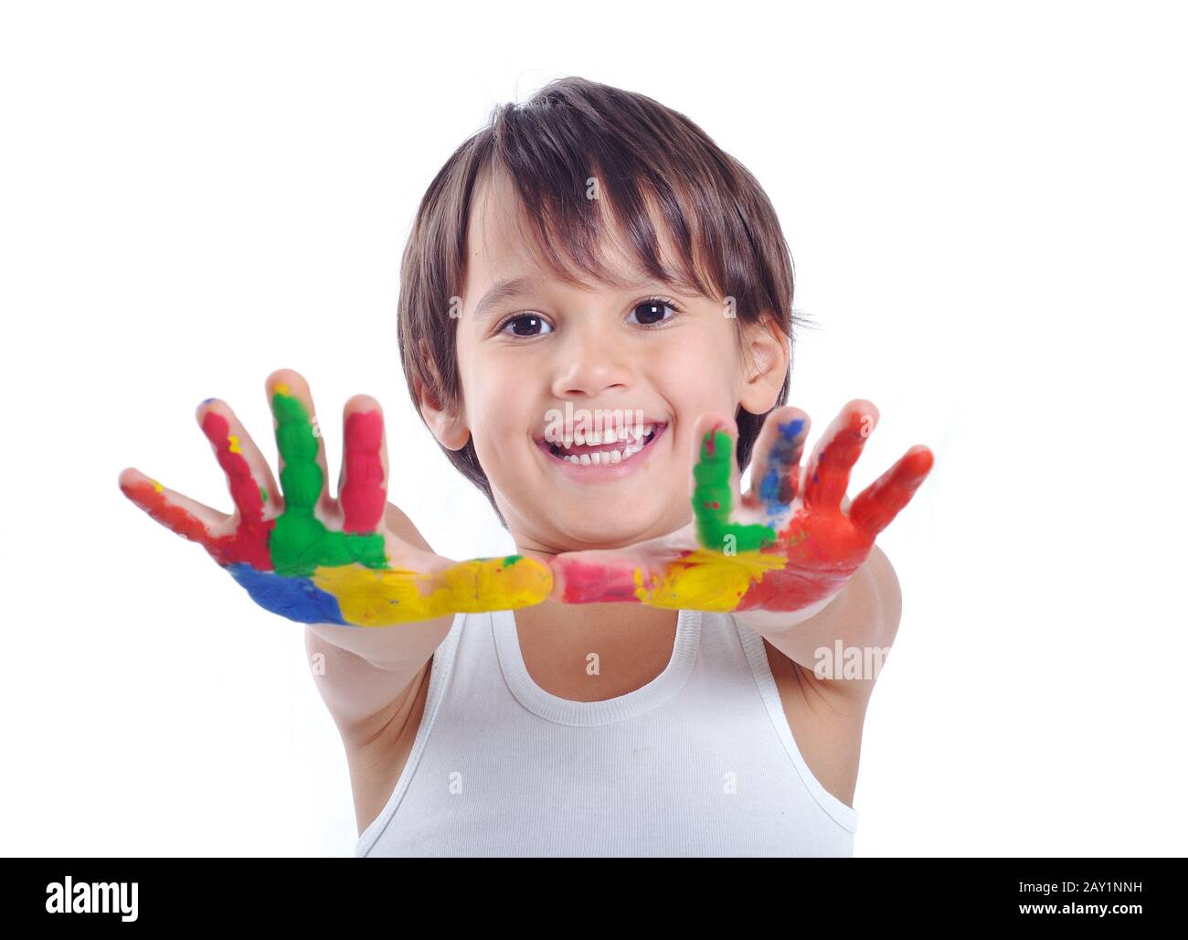 Five year old boy with hands painted in colorful paints ready for hand ...