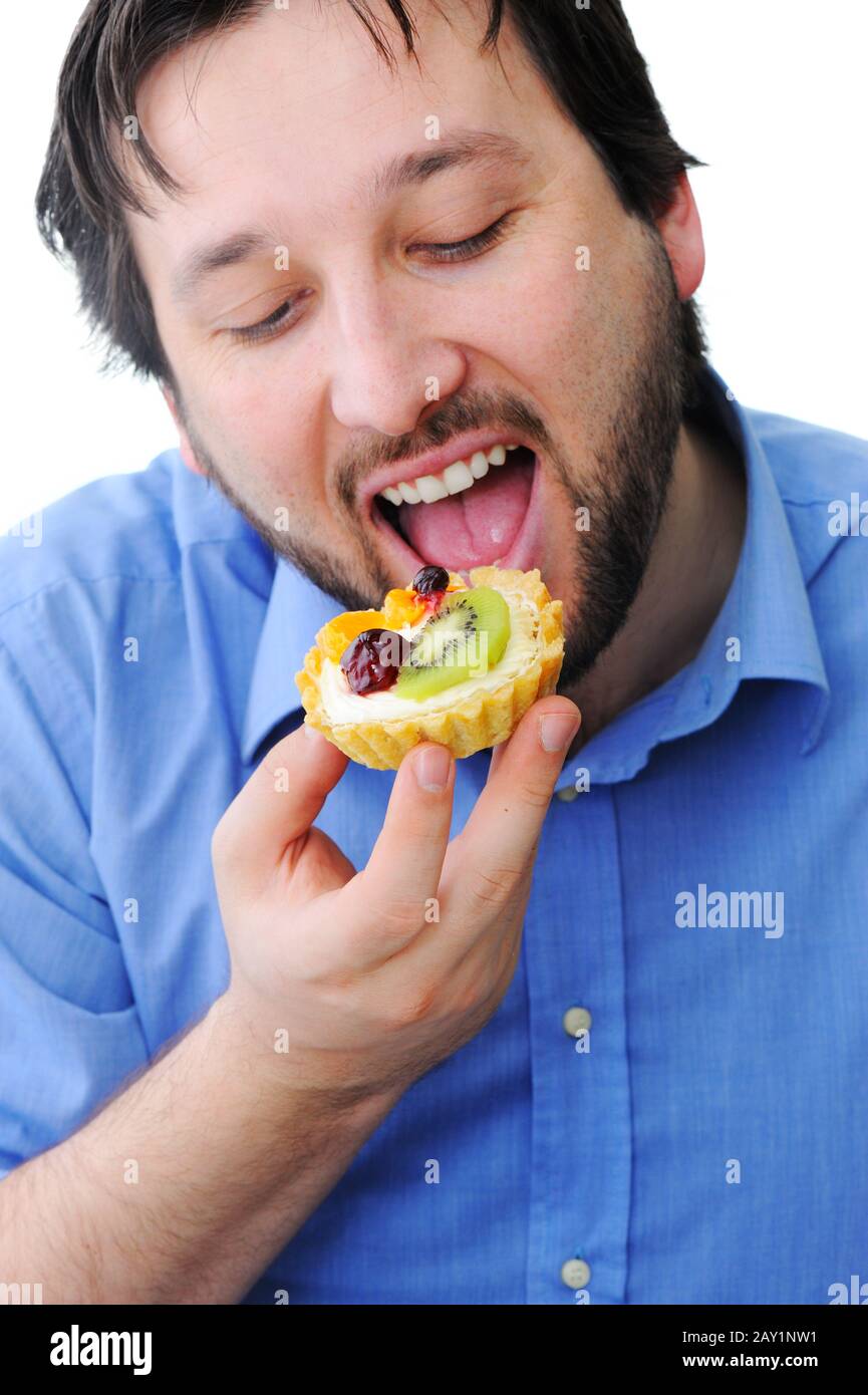 Adult man eating delicious cake Stock Photo - Alamy