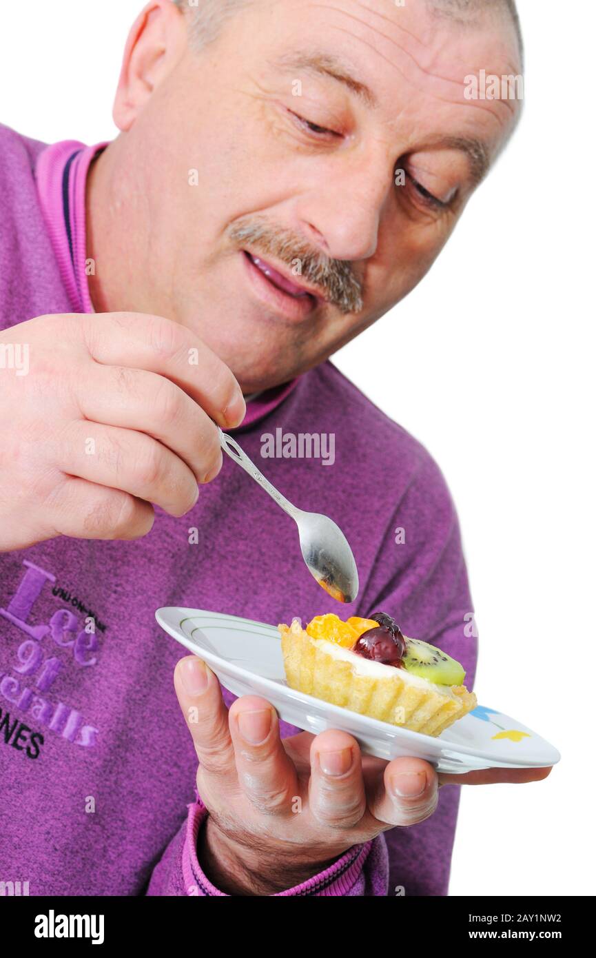 Old man eating delicious cake Stock Photo - Alamy