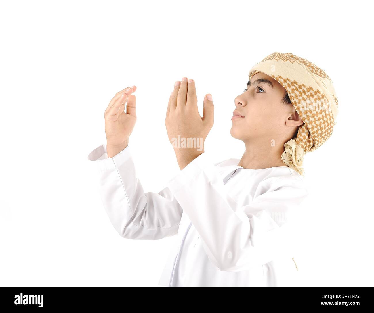 Arabic kid praying isolated Stock Photo - Alamy