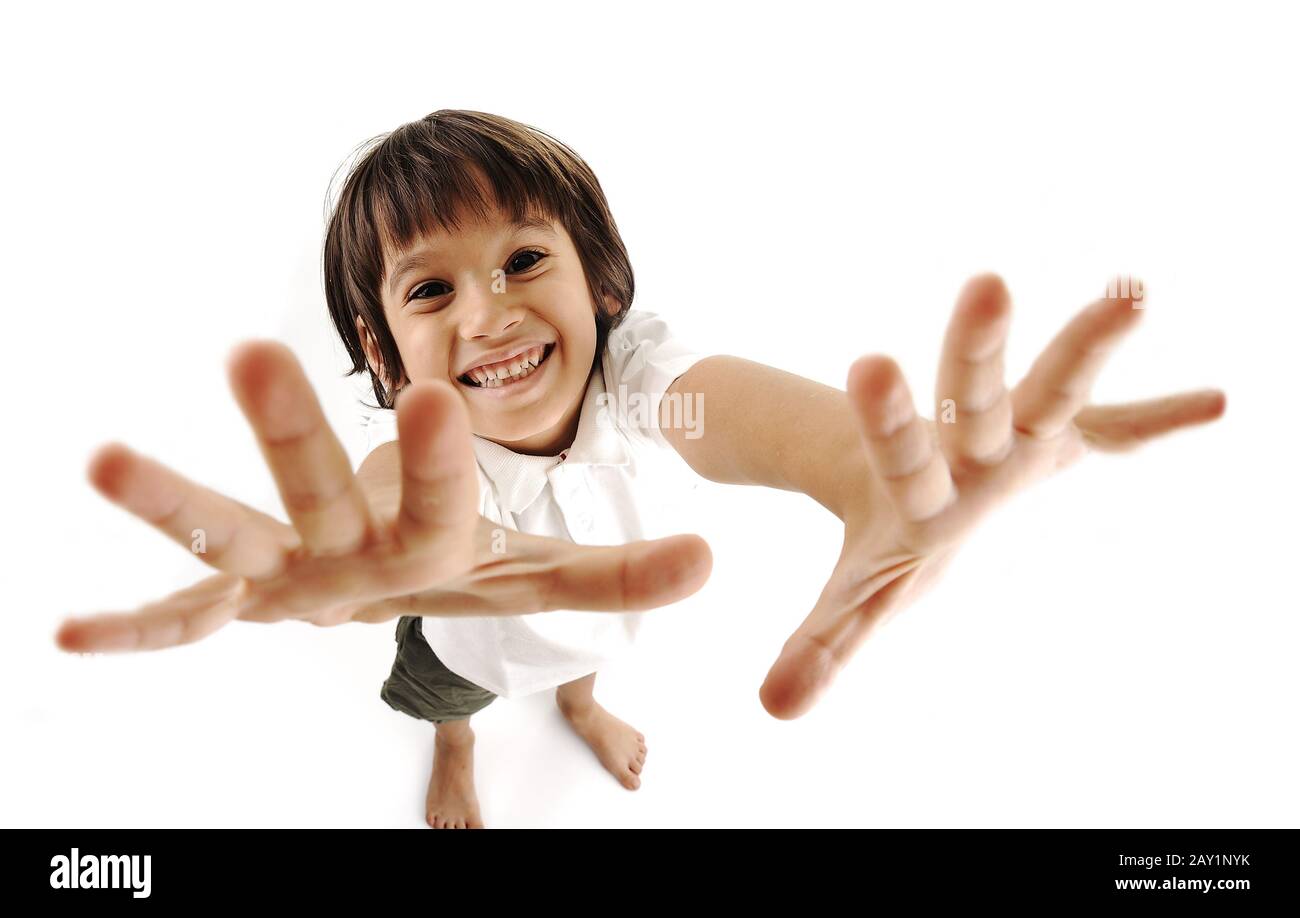 Positive cute kid trying to catch you Stock Photo - Alamy