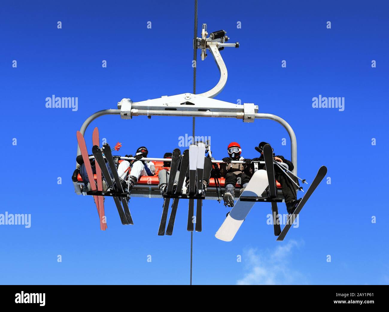 Skiers ride chairlift top hi-res stock photography and images - Alamy