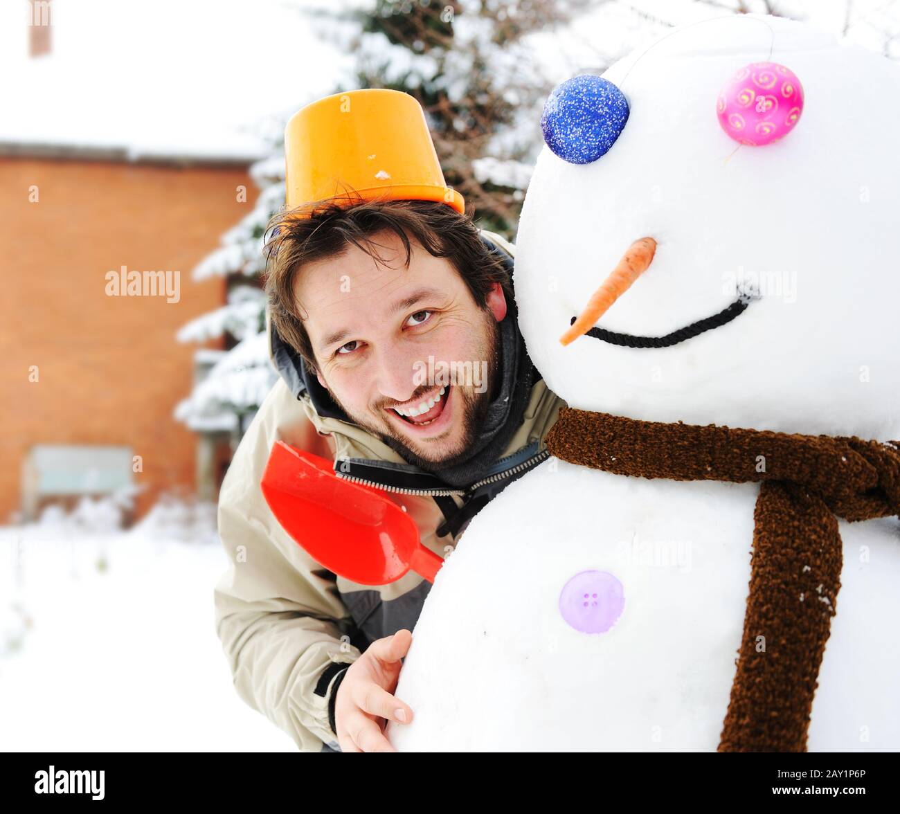 Winter snowman, snow show and happy funny young man who made him Stock ...