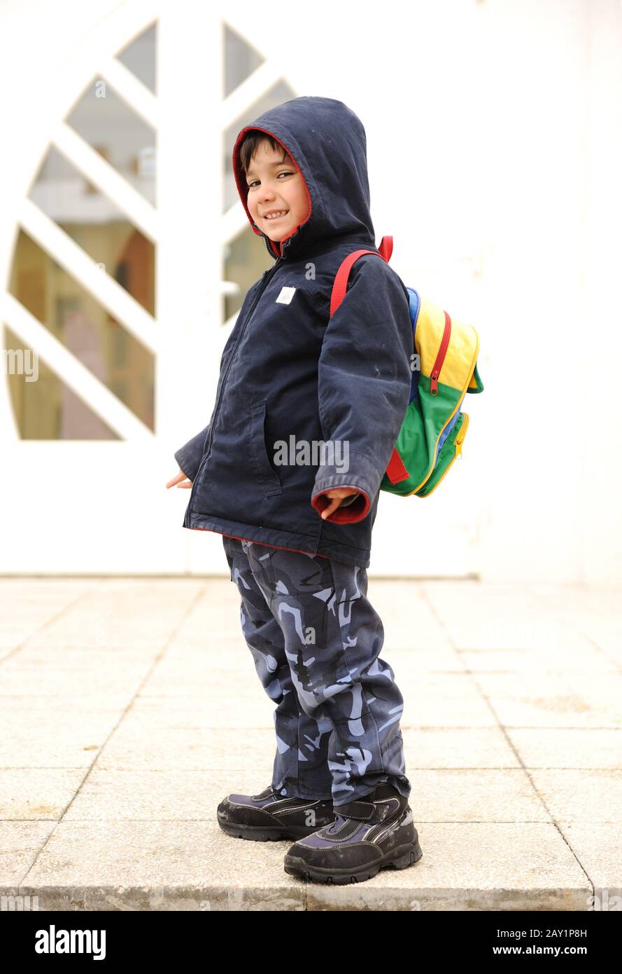 Little cute preschool child with bag on his back Stock Photo - Alamy