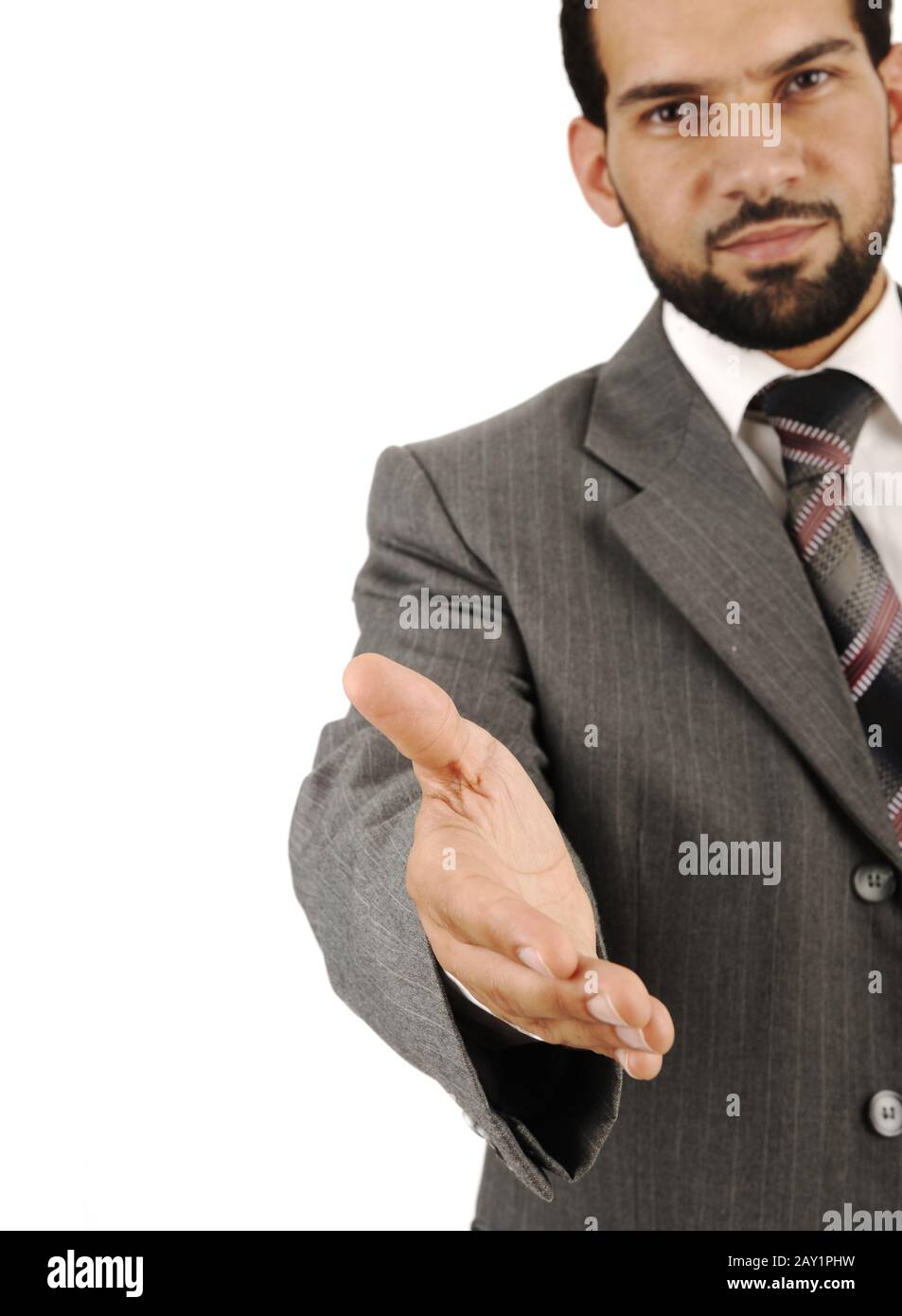 Happy smiling young business man giving hand for handshake Stock Photo ...