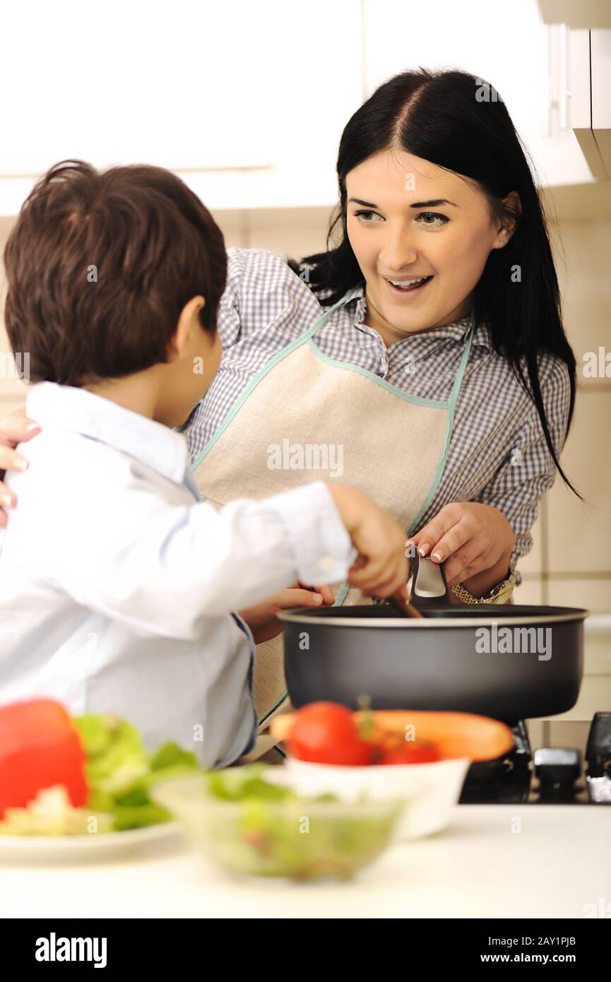 Mother And Children Prepare A meal Stock Photo - Alamy