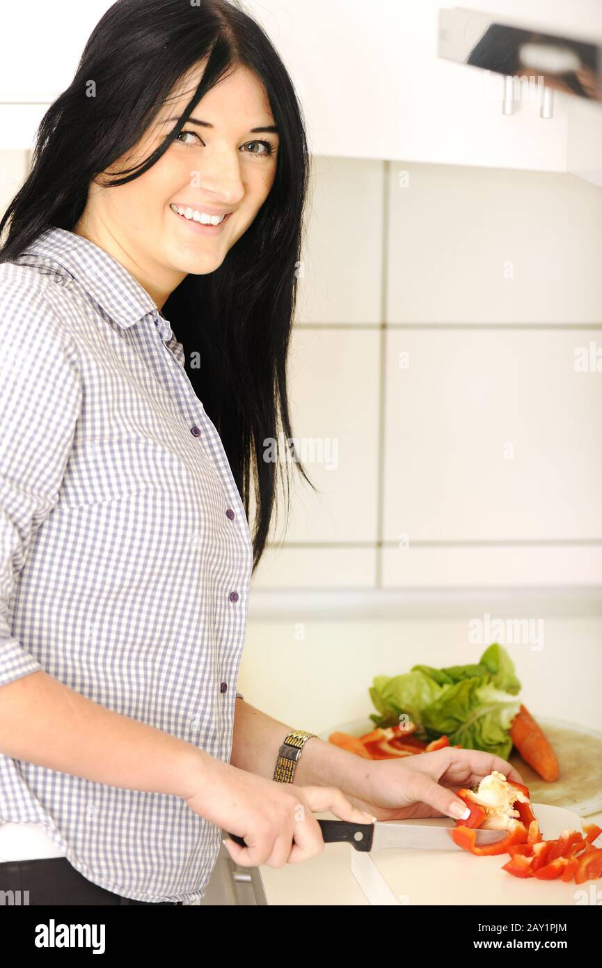 Kitchen woman cooking standing hi-res stock photography and images - Alamy