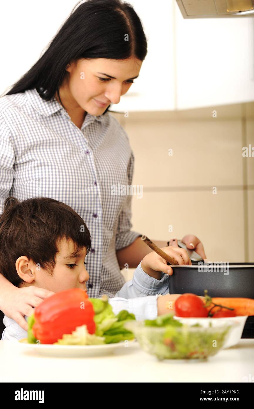Mother And Children Prepare A meal Stock Photo - Alamy