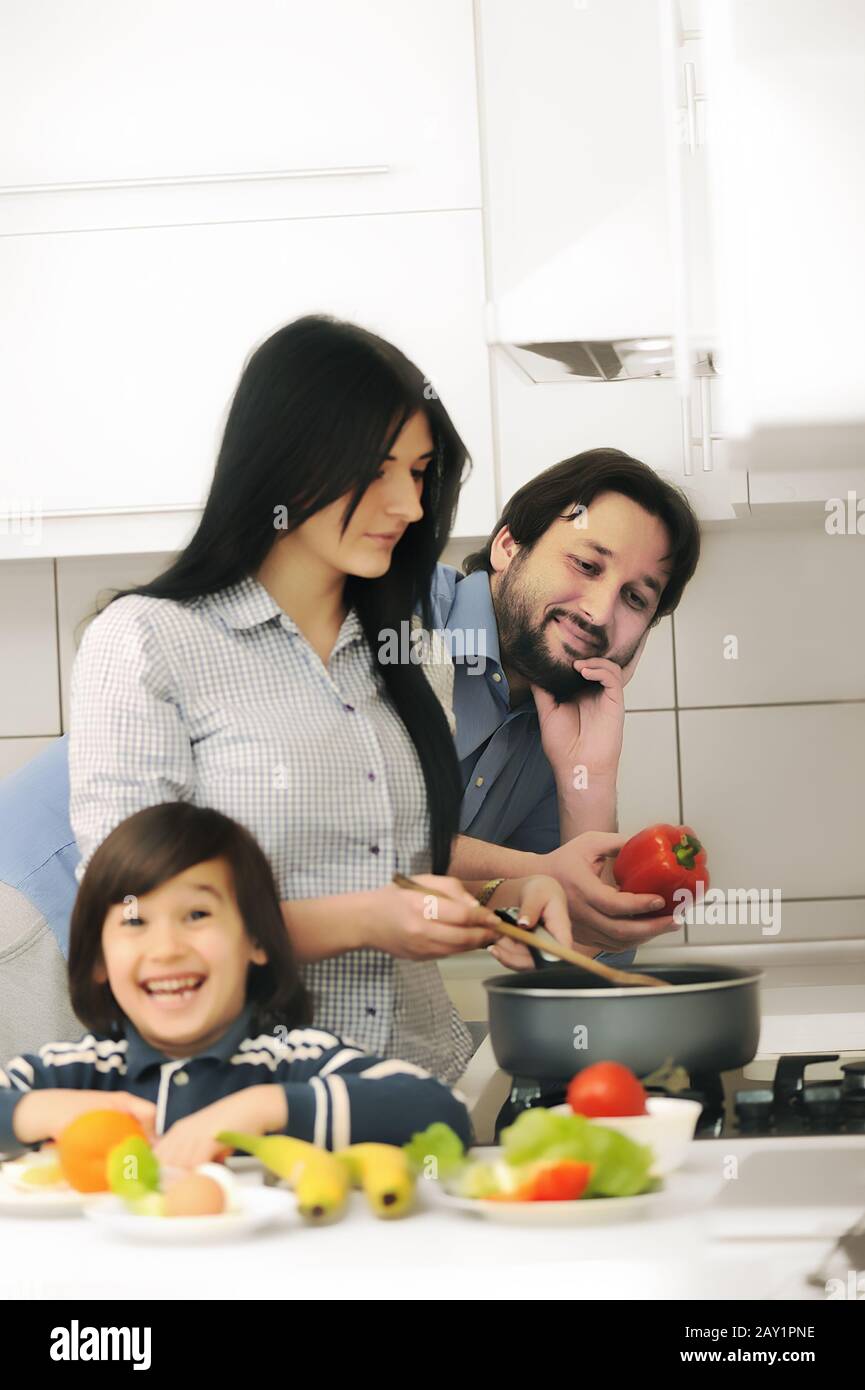 Happy family in kitchen Stock Photo - Alamy