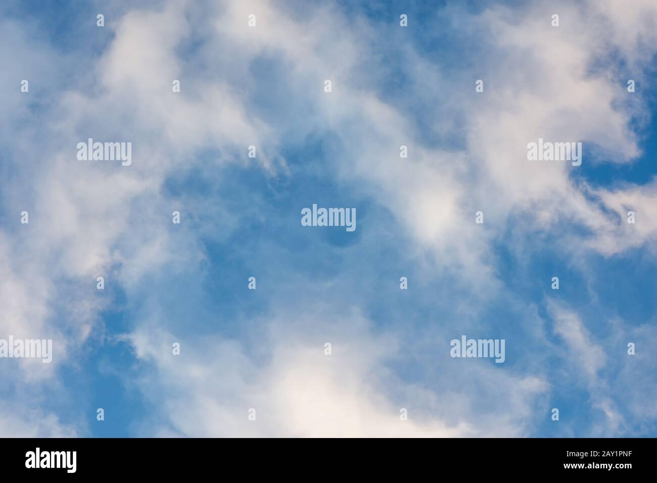 texture bright contrast sky with clouds and sun rays Stock Photo - Alamy