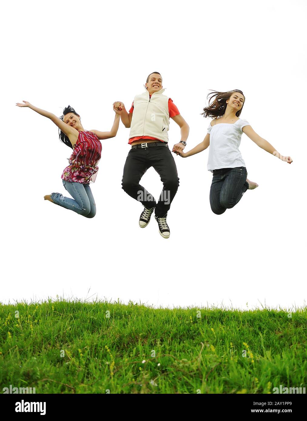 Three friends jumping together outdoor Stock Photo - Alamy