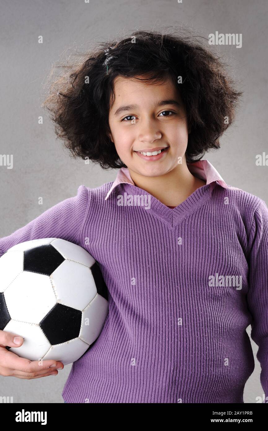 Young Girl with Football Stock Photo - Alamy