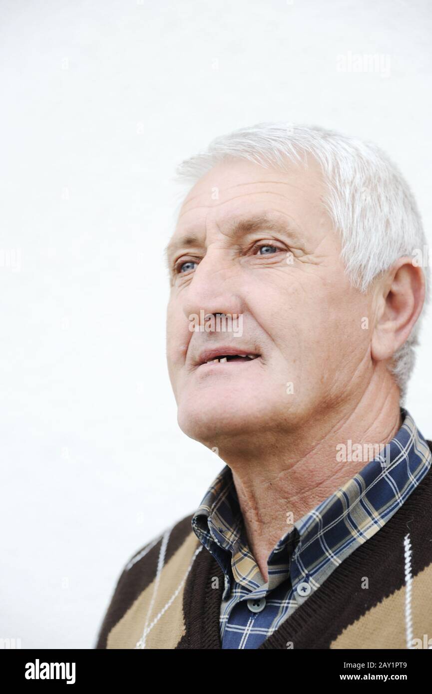 Closeup Profile on a good looking smiling Old Man Stock Photo - Alamy
