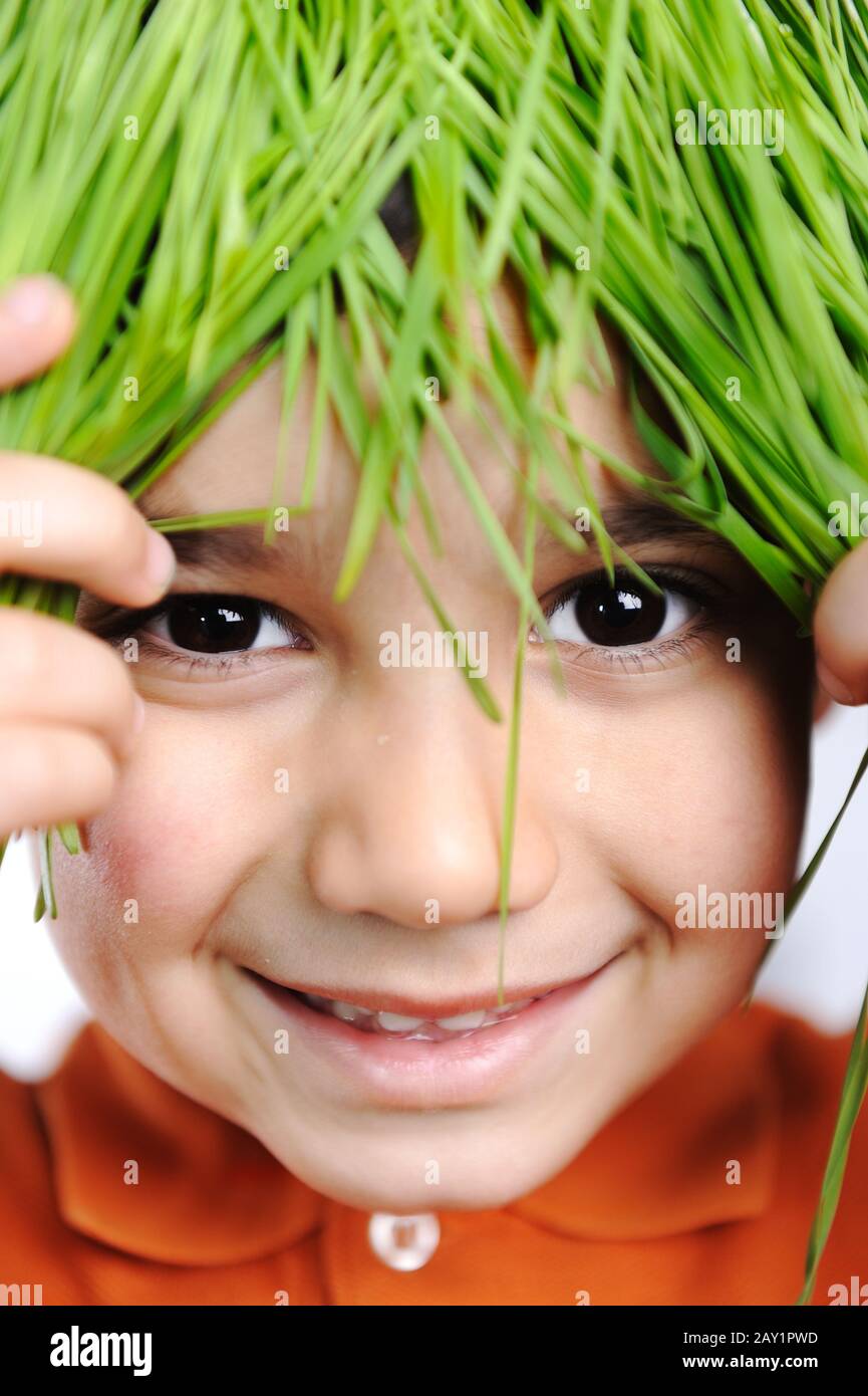 Cute happy kid with grass hair Stock Photo - Alamy