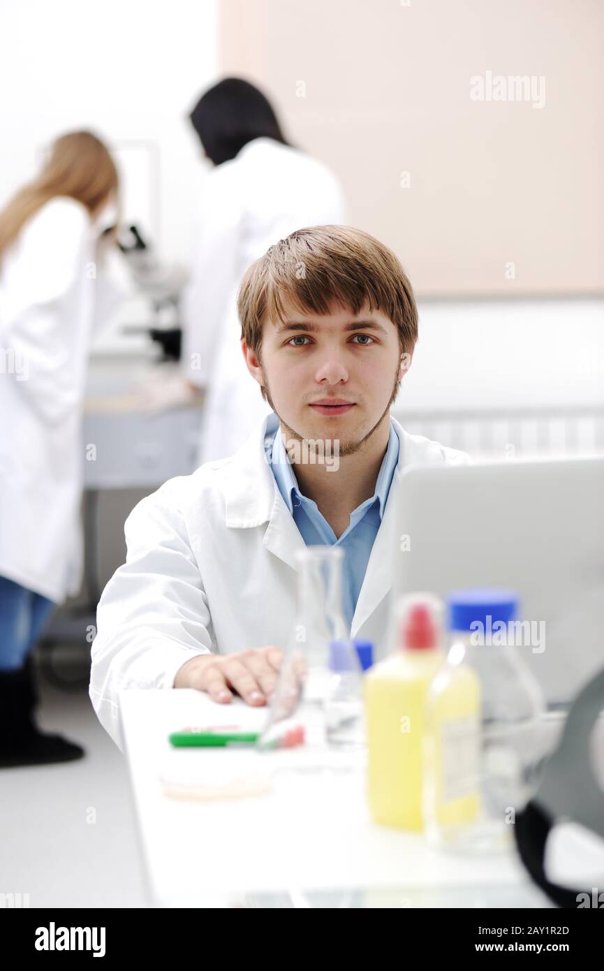 Young medical scientist working in modern lab Stock Photo - Alamy
