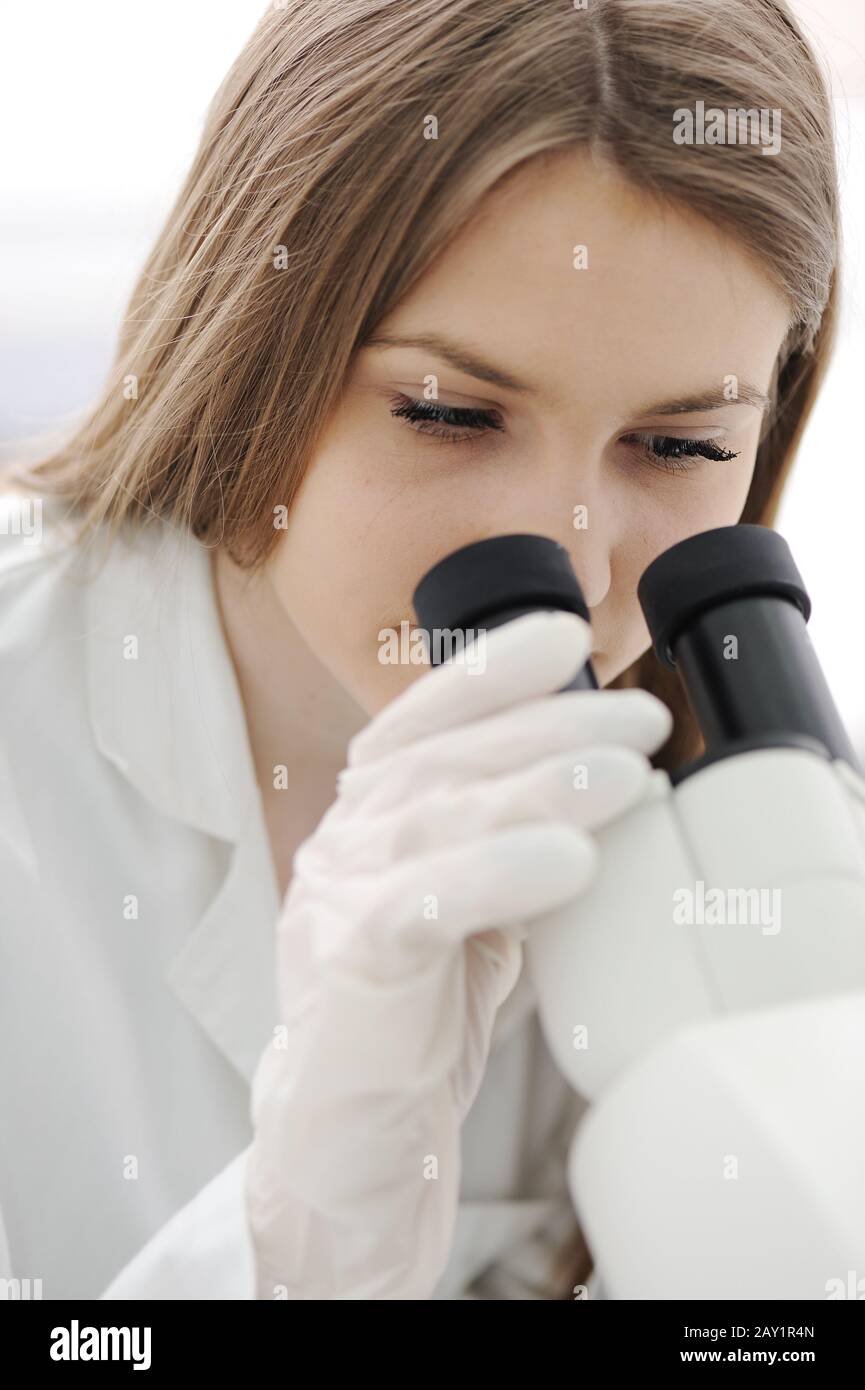Female medical doctor using microscope in a laboratory Stock Photo - Alamy