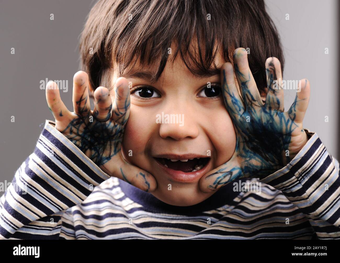 Child with messy hands Stock Photo - Alamy