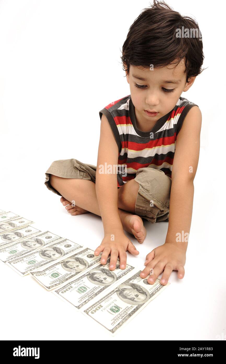 Cute little kid plays with money Stock Photo - Alamy
