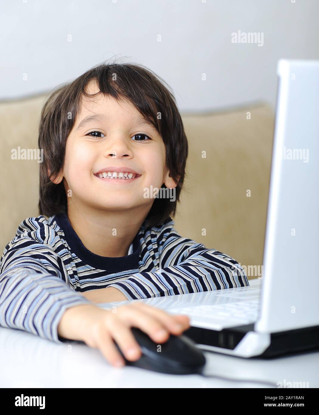 Childhood, laptop, learning and playing Stock Photo - Alamy