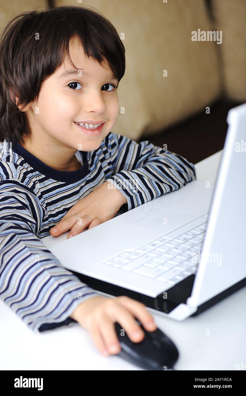 Childhood, laptop, learning and playing Stock Photo - Alamy