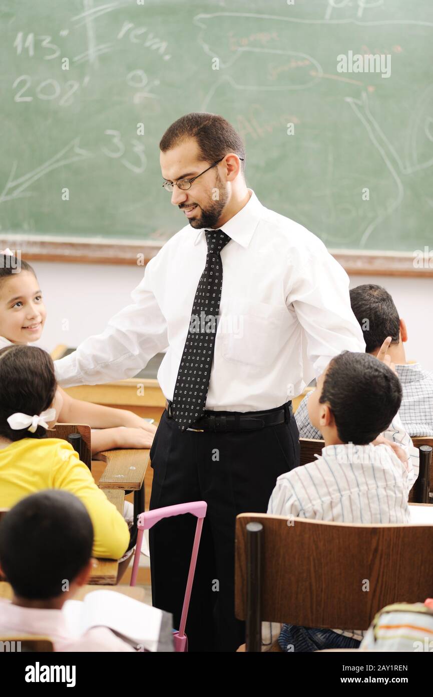 Education activities in classroom at school, happy children learning ...