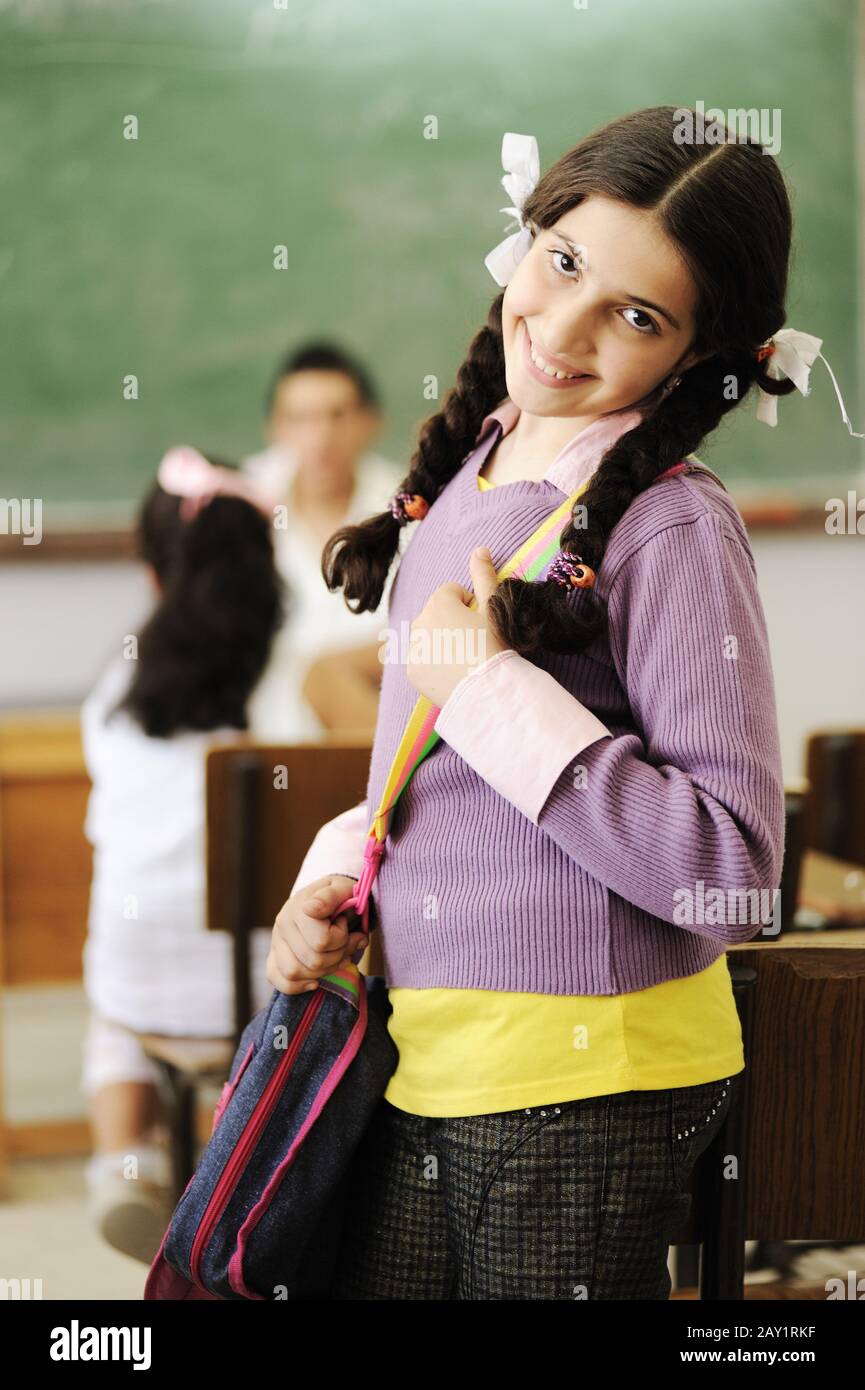 Education activities in classroom at school, happy children learning ...