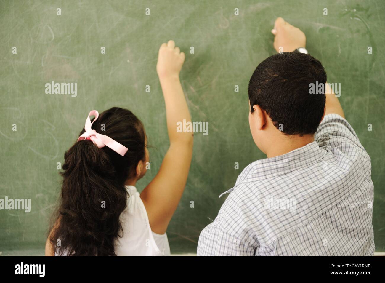Happy children in classroom Stock Photo - Alamy