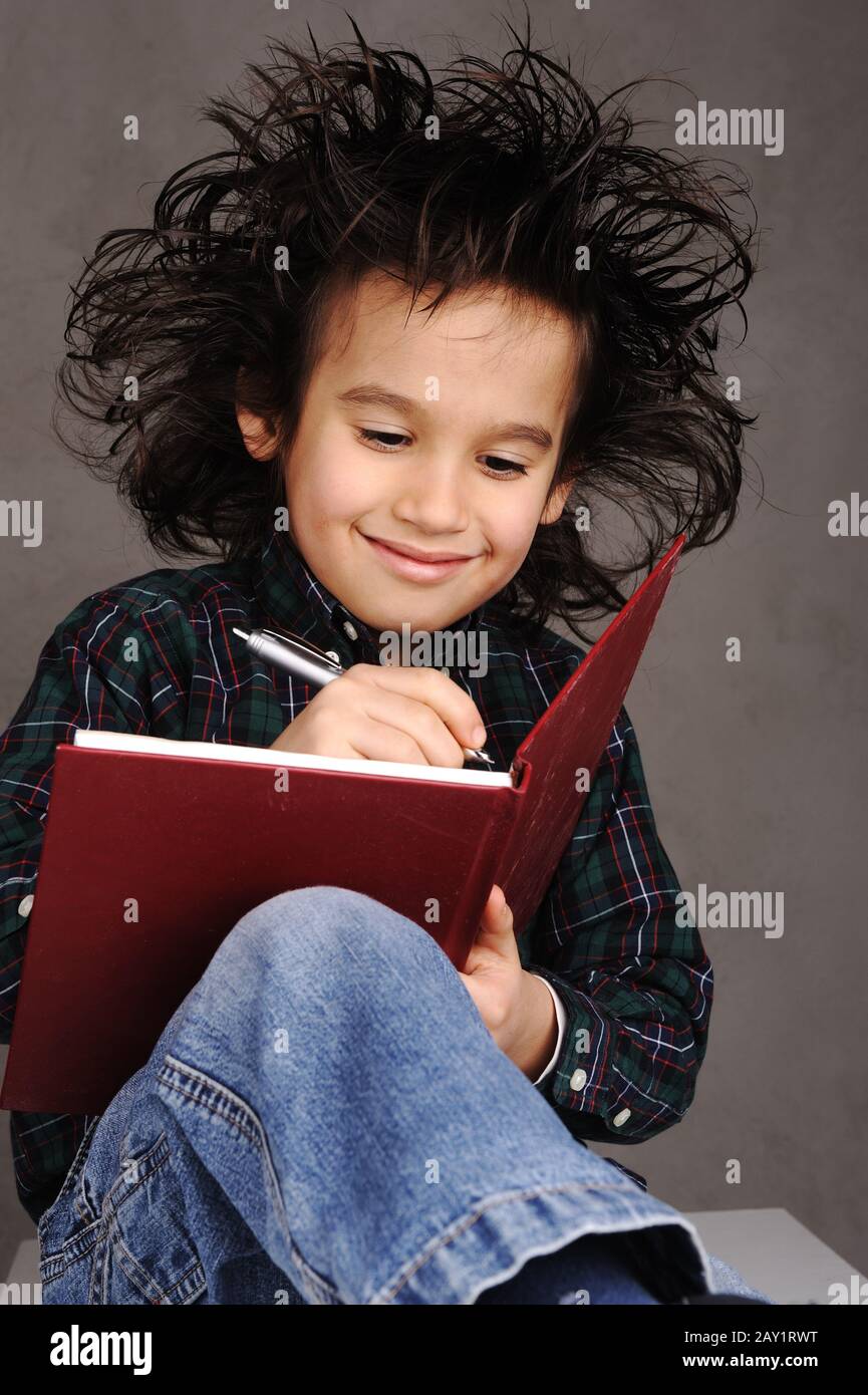 Smiling little boy drawing Stock Photo - Alamy