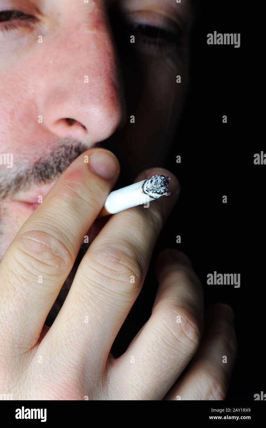 Adult man smoking cigarette night hi-res stock photography and images ...
