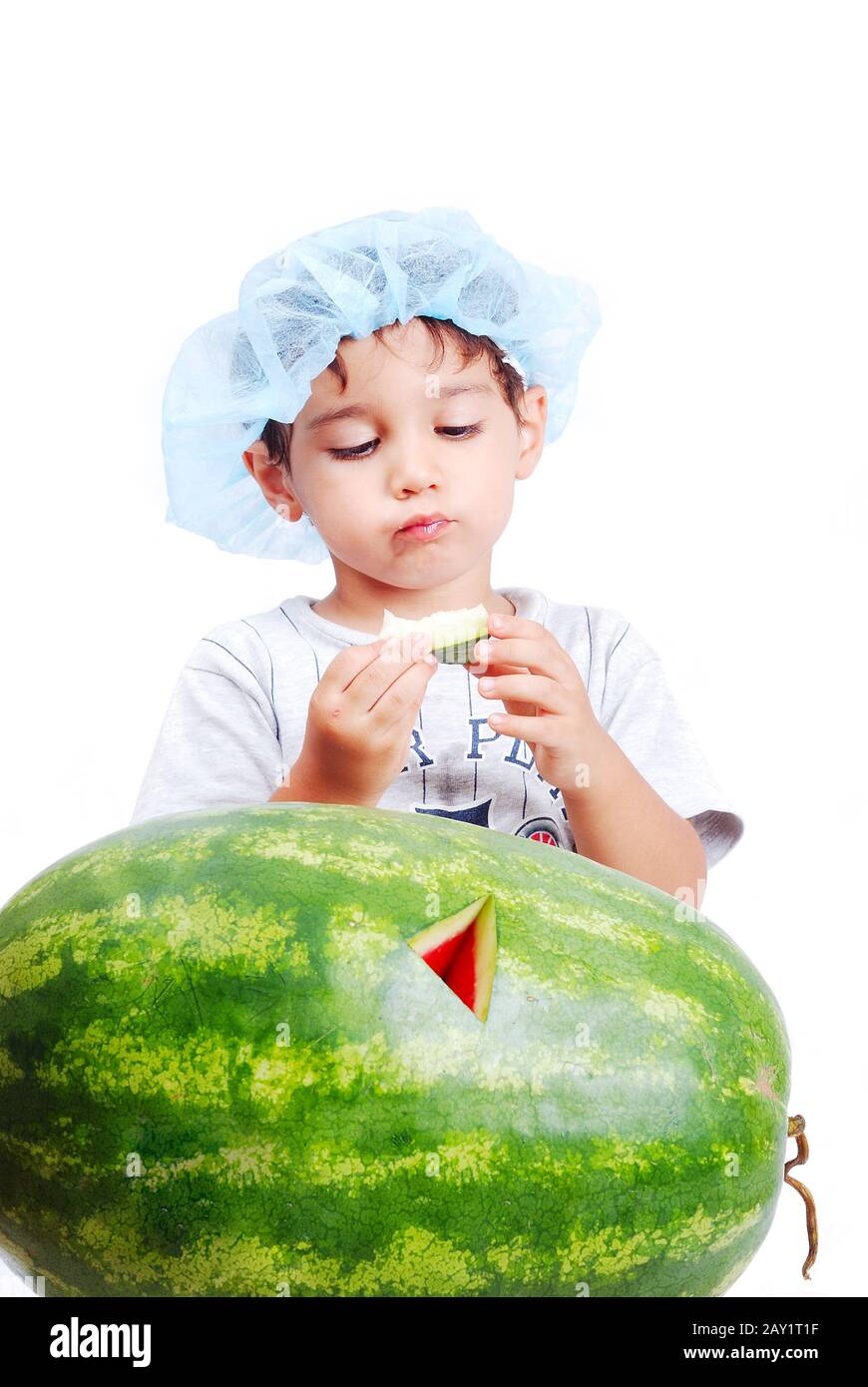 Kid eating water melon Stock Photo - Alamy