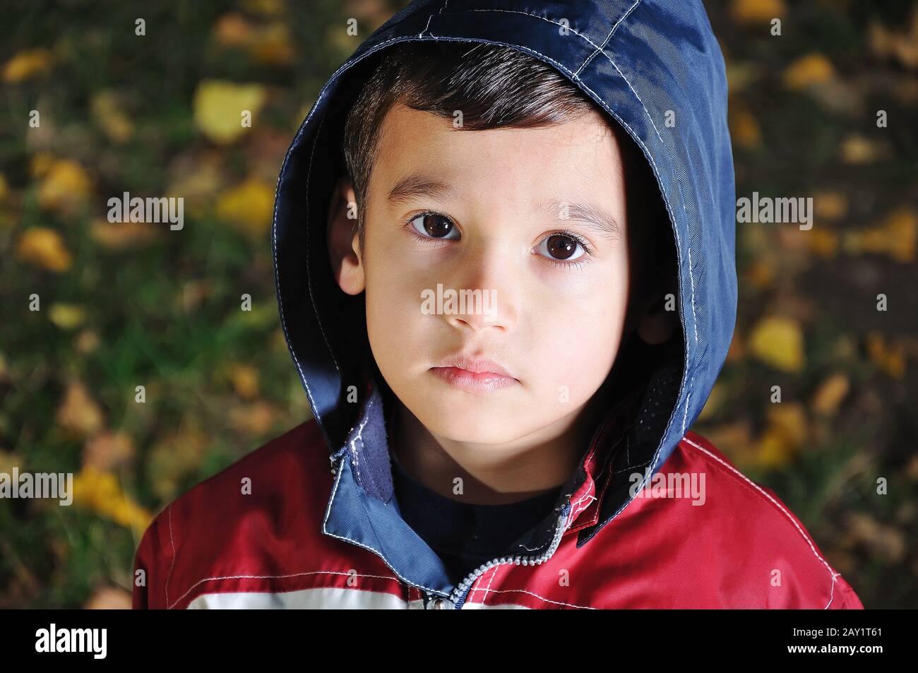 Little cute sad kid outdoor Stock Photo - Alamy