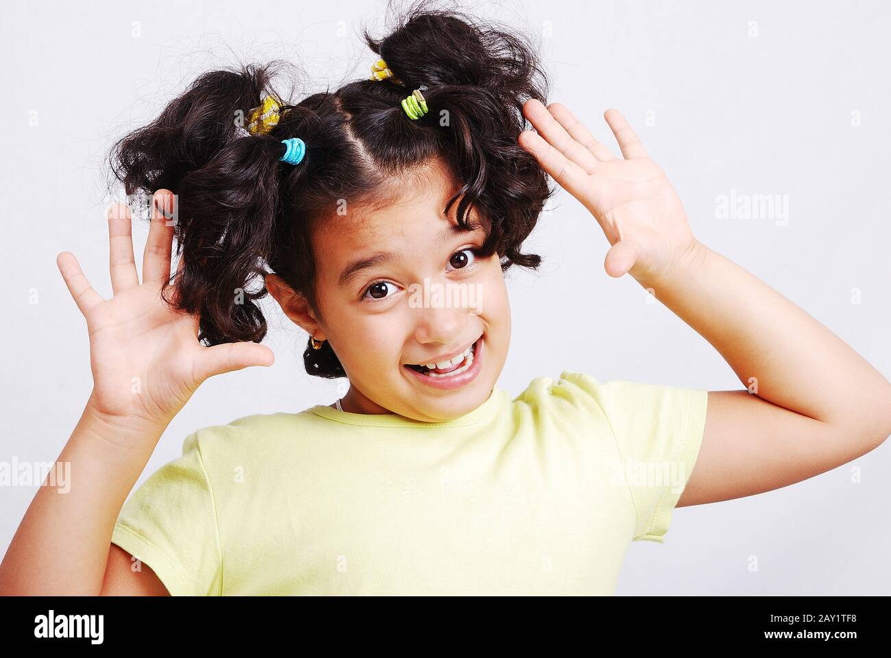 Little cute girl with hands up Stock Photo - Alamy
