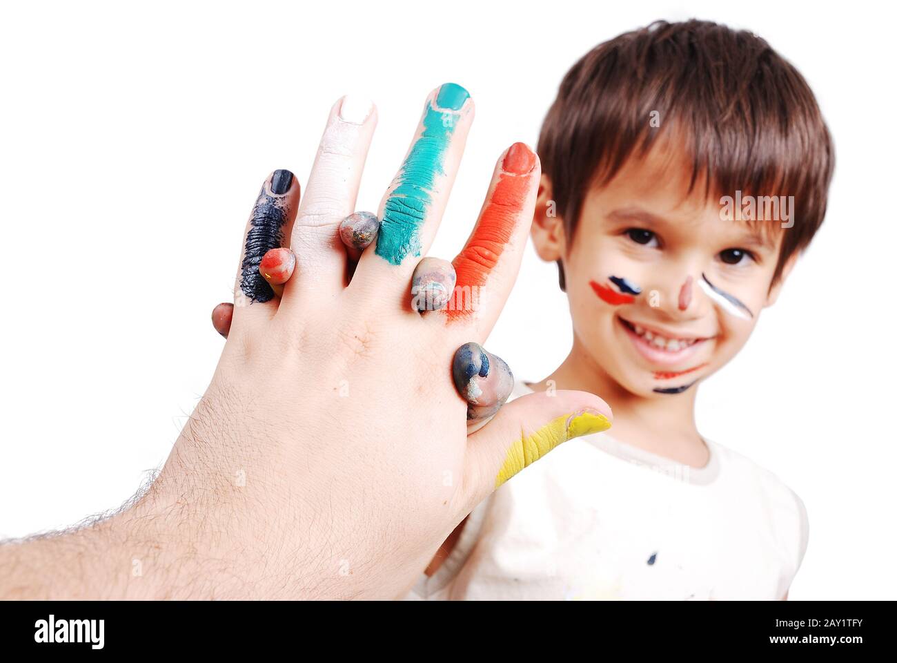 Little cute kid with colors on his face Stock Photo - Alamy