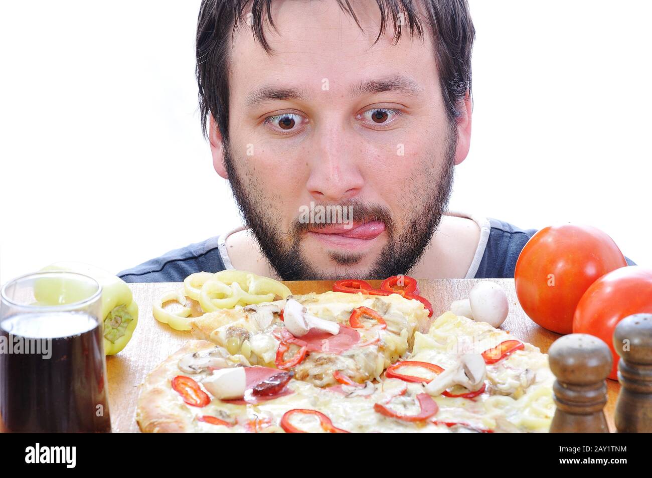 Adult person with surprised face on pizza table Stock Photo - Alamy