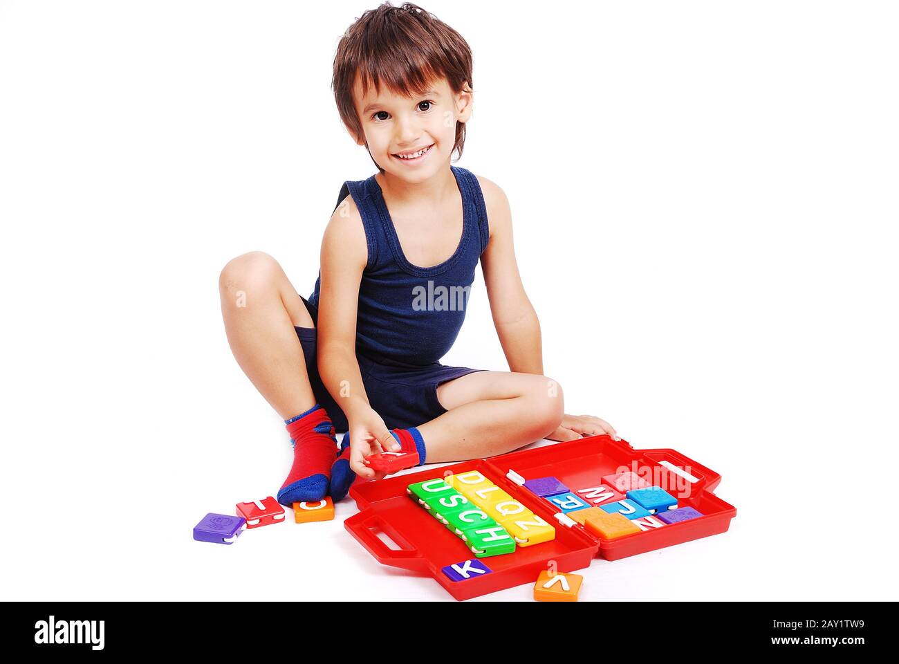 Happy children playing cubes hi-res stock photography and images - Alamy