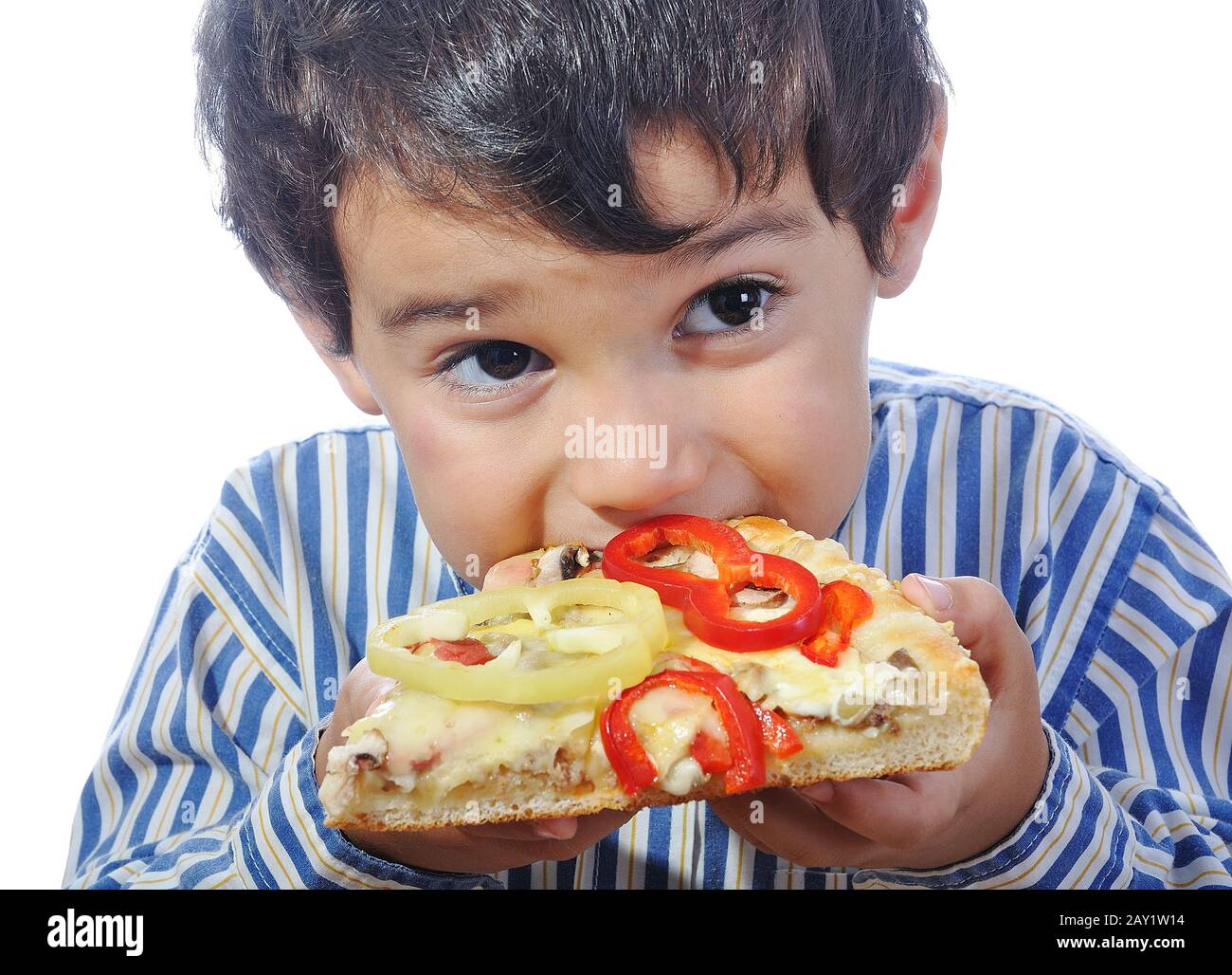 Cute little boy eating pizza Stock Photo - Alamy