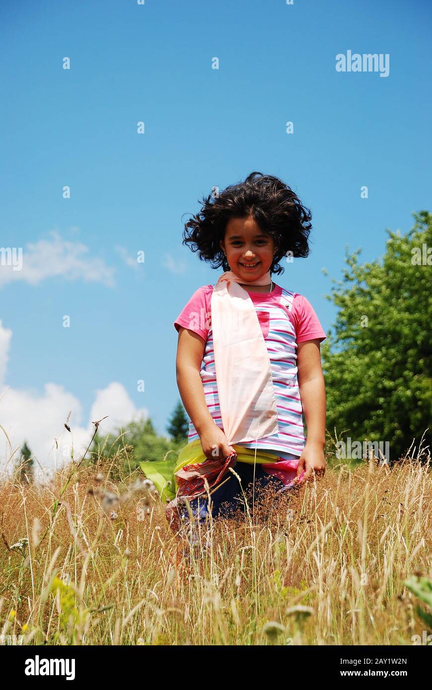 Very cute girl in beautiful clothes on outdoor scene Stock Photo - Alamy