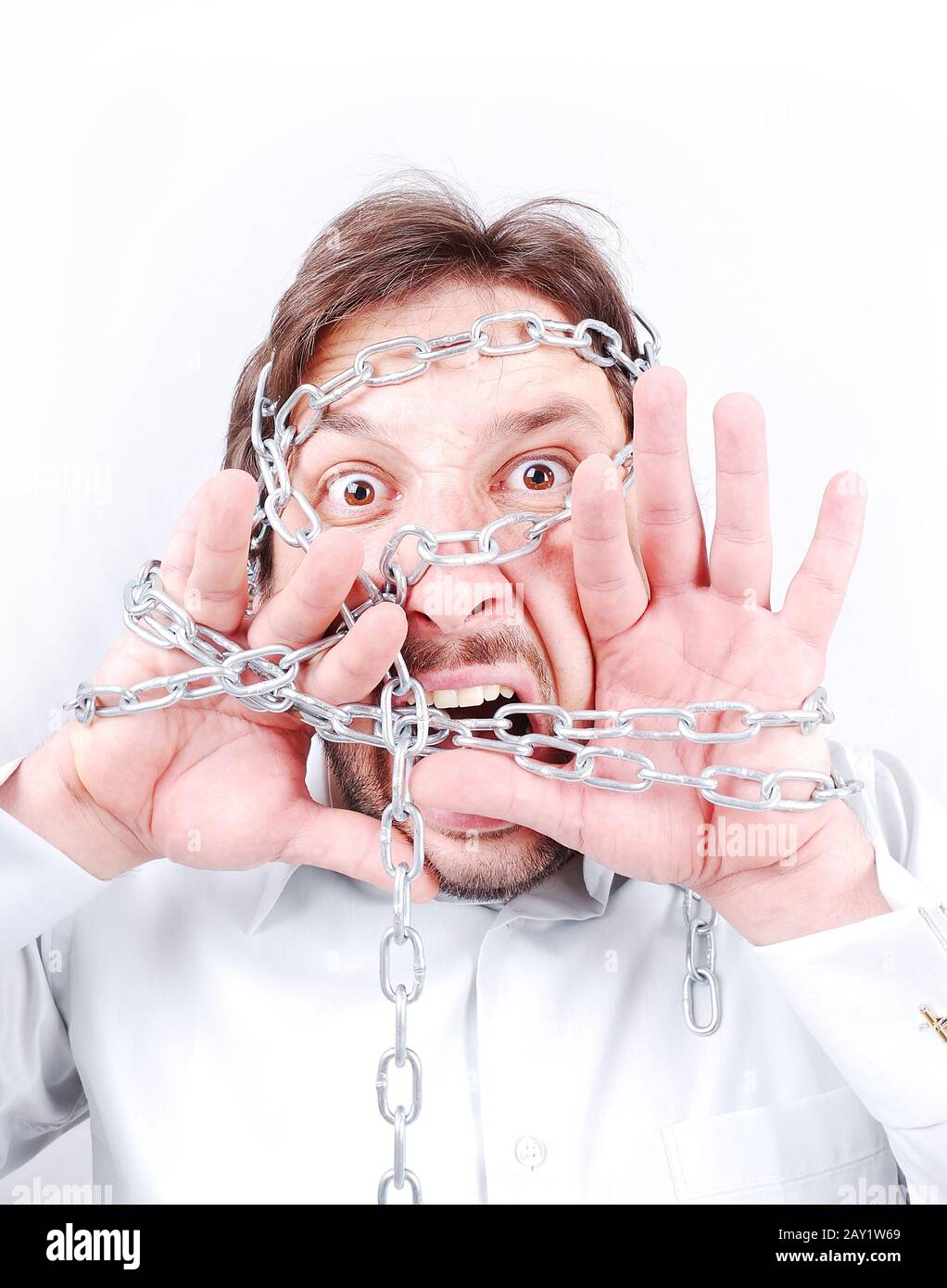 Chained man screaming Stock Photo - Alamy