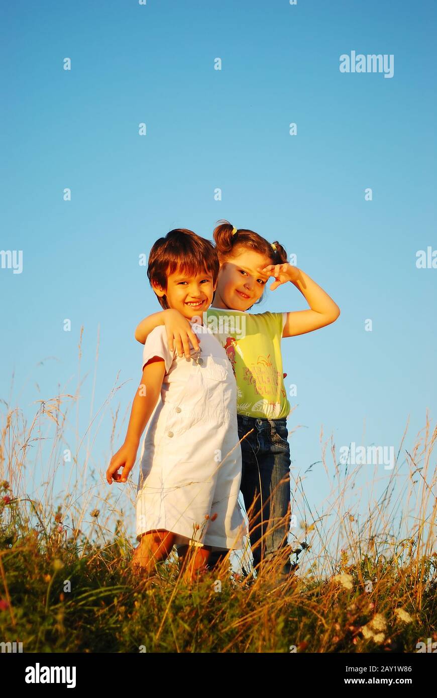 Romantic vision of two children standing together outdoor Stock Photo ...