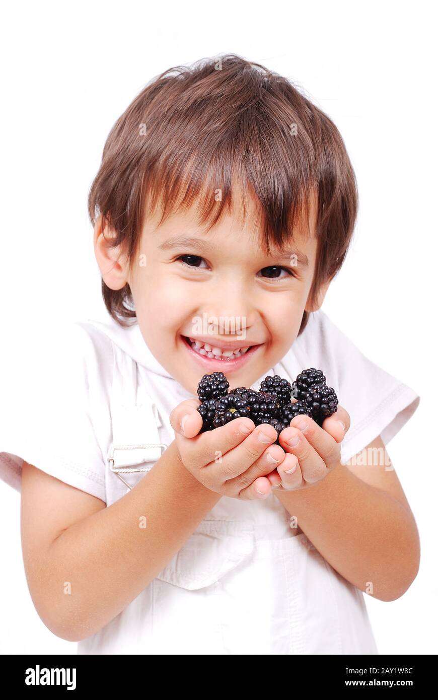 Little cute white kid with blackberry in hands Stock Photo - Alamy