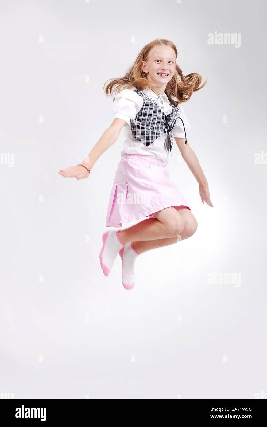 Happy child is jumping high Stock Photo - Alamy