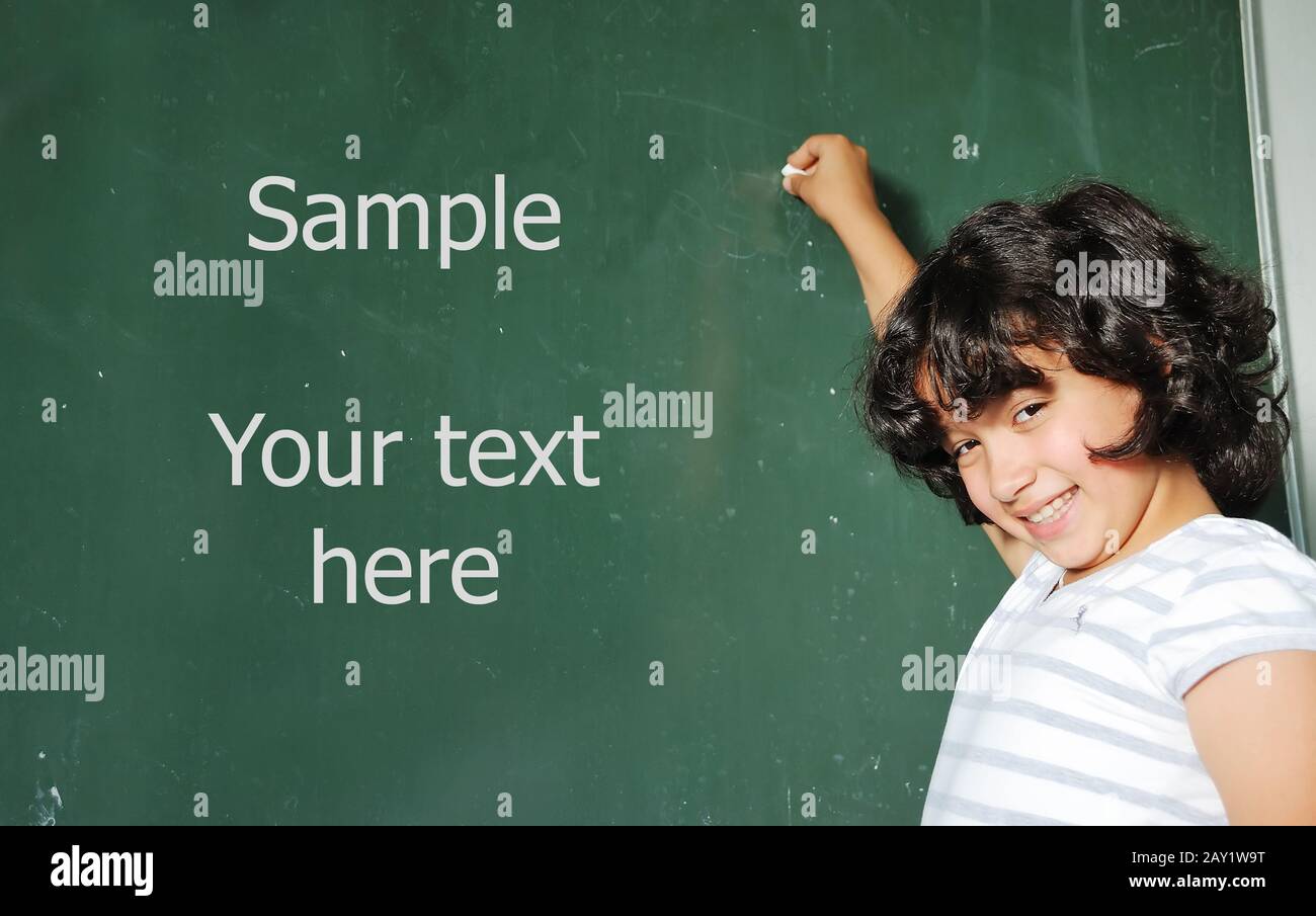 Classroom at school and text on green board Stock Photo - Alamy