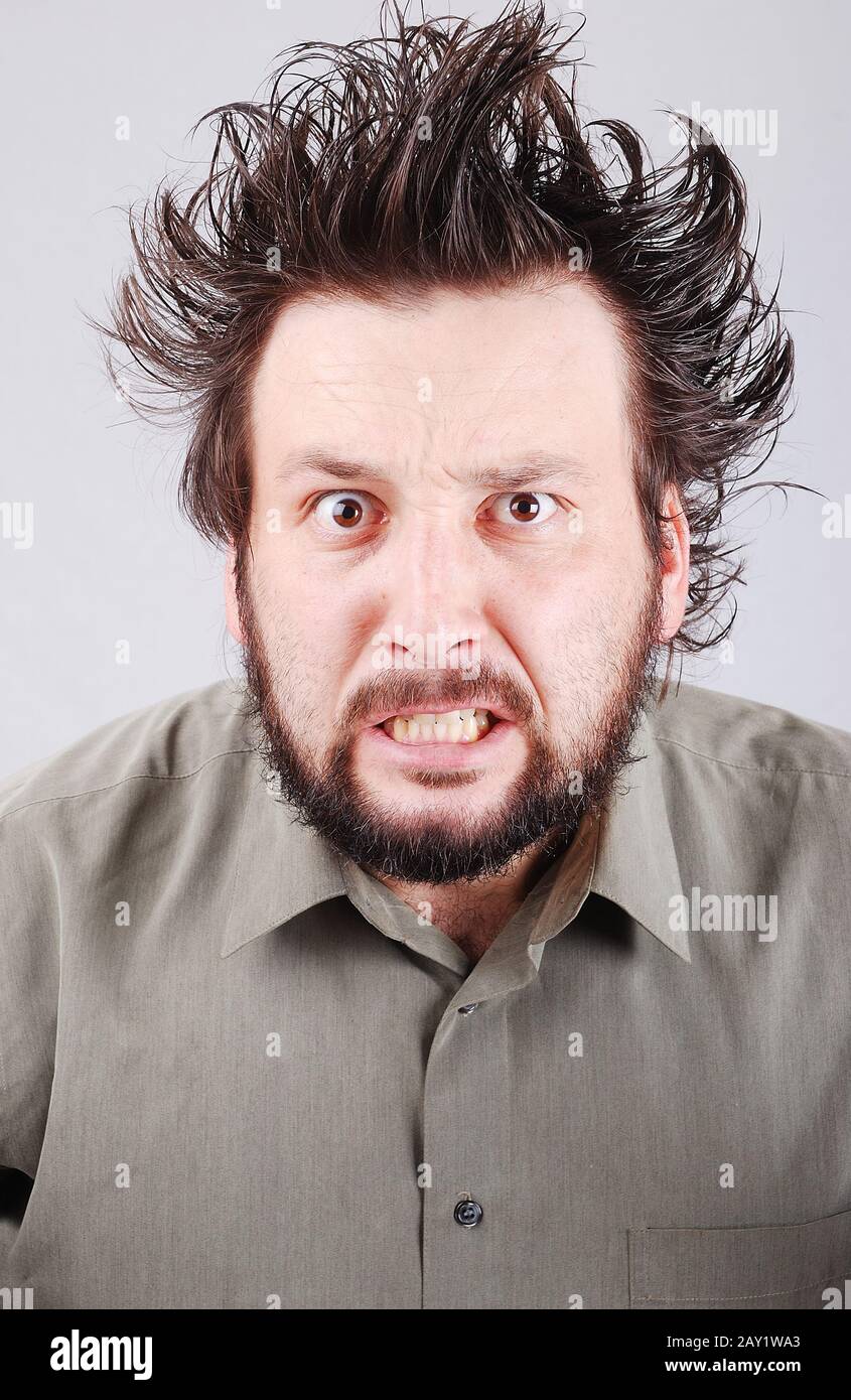 Young male model with funny hair with expression on face Stock Photo ...