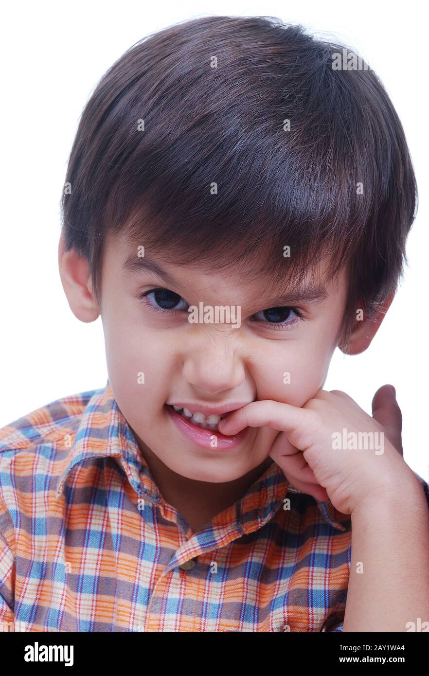Cute boy is bitting fingernails Stock Photo - Alamy