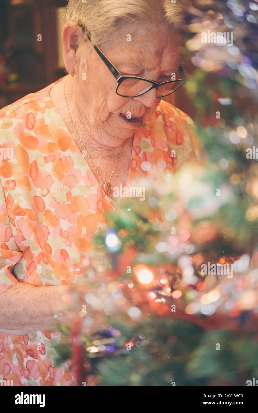 Woman decorating christmas tree candy hi-res stock photography and ...