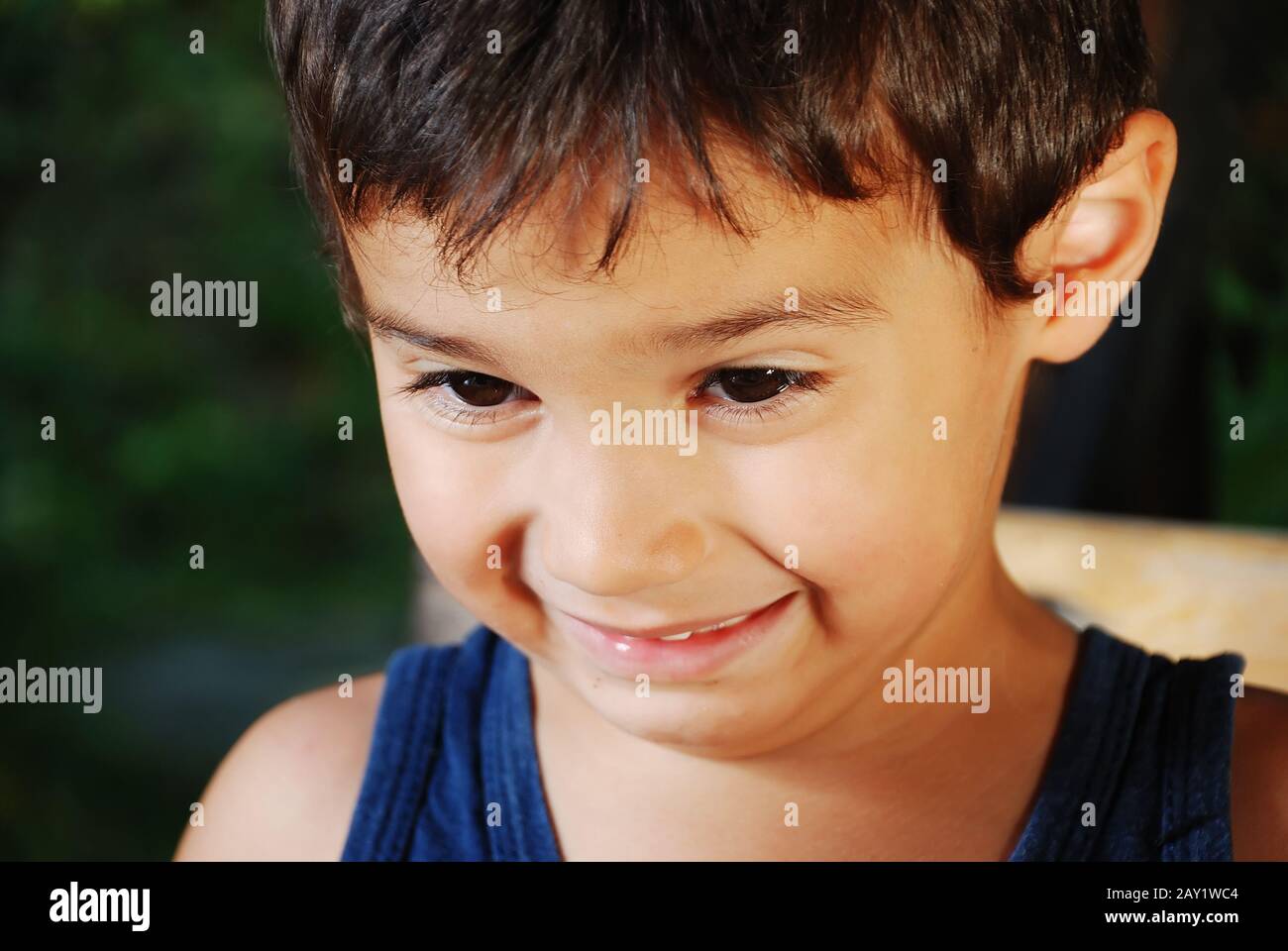 Cute male child is sitting outdoor Stock Photo - Alamy