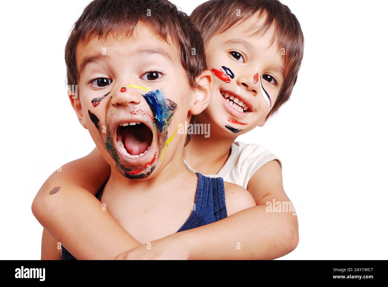 Two little cute brothers with colors on their faces Stock Photo - Alamy
