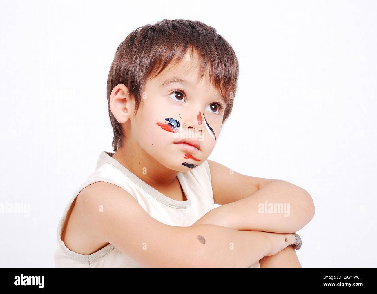 Little cute kid with colors on his face Stock Photo - Alamy