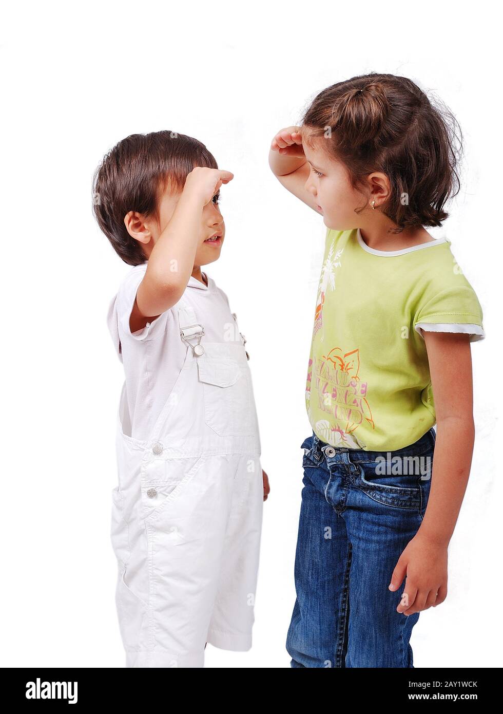 Two children measuring their height Stock Photo - Alamy